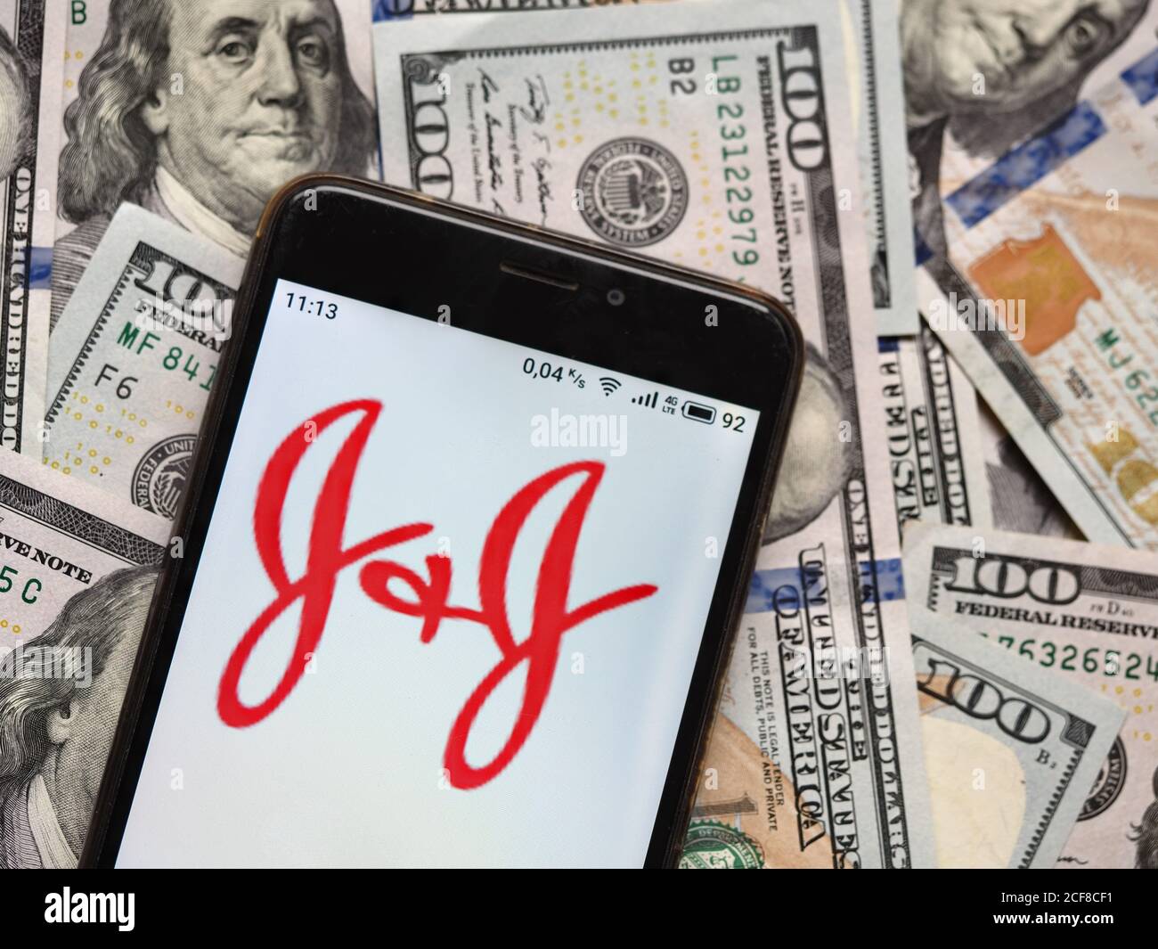 In this photo illustration a Johnson & Johnson logo is seen displayed ...