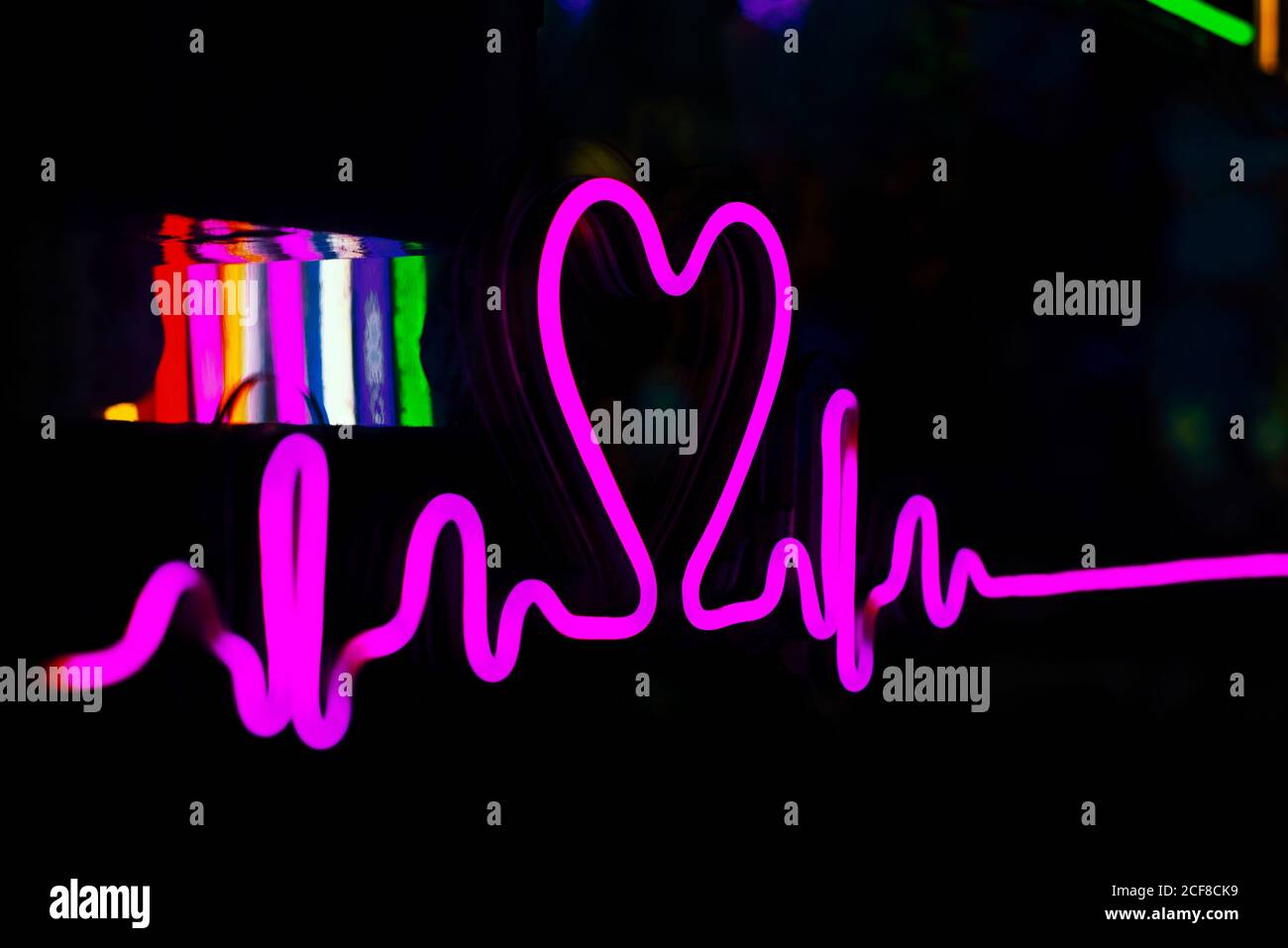 Neon heart display on the window of a store Stock Photo - Alamy