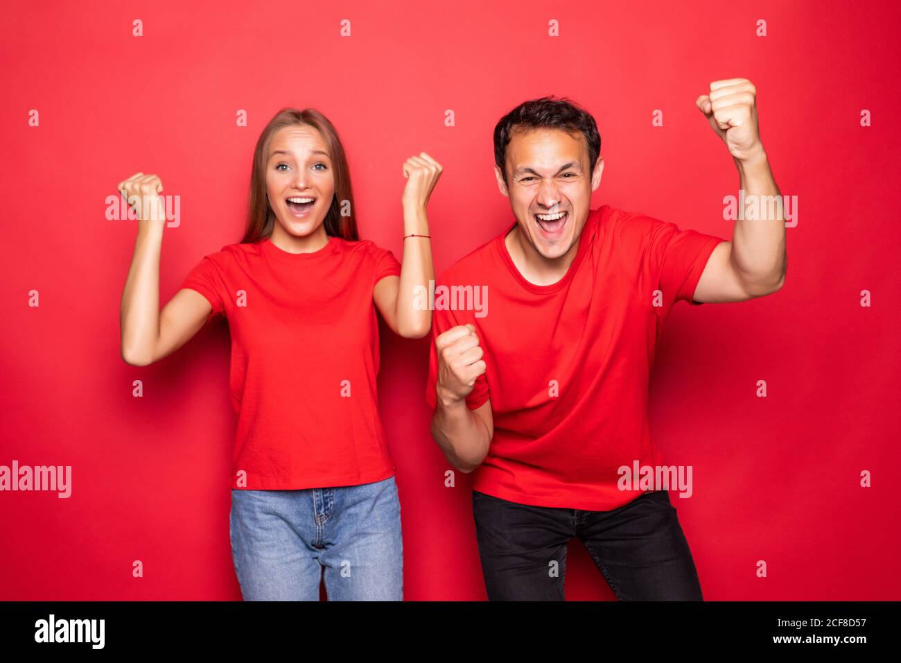 Portrait of handsome beautiful couple of two people rejoicing with ...