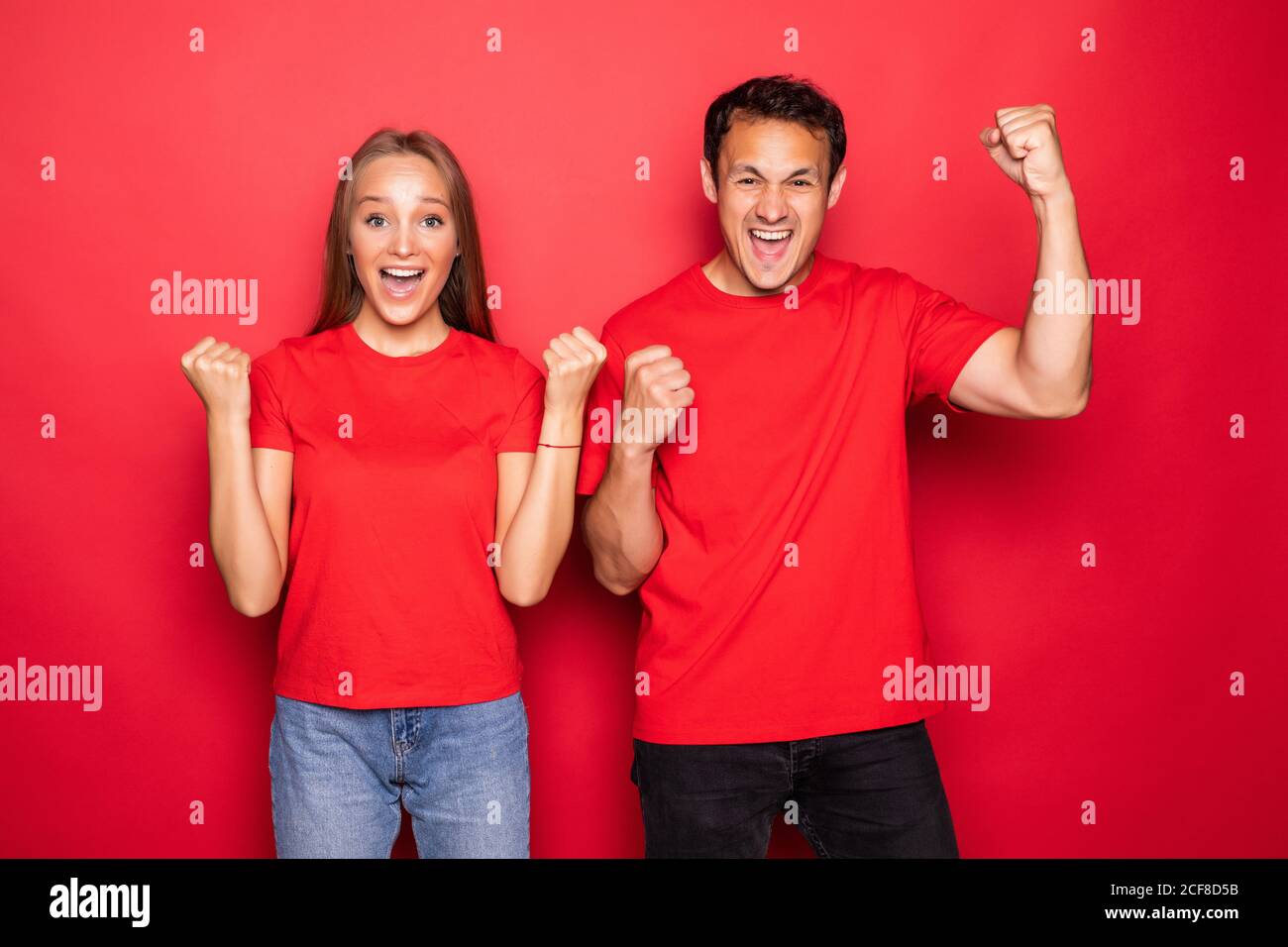 Portrait of handsome beautiful couple of two people rejoicing with ...