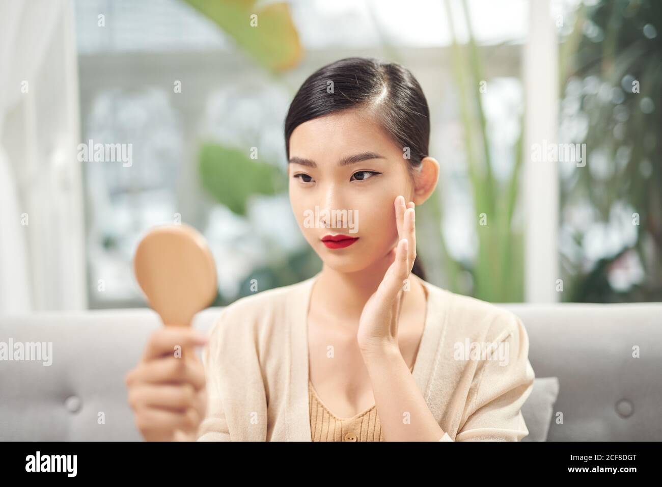 Young woman having skin problems Stock Photo - Alamy