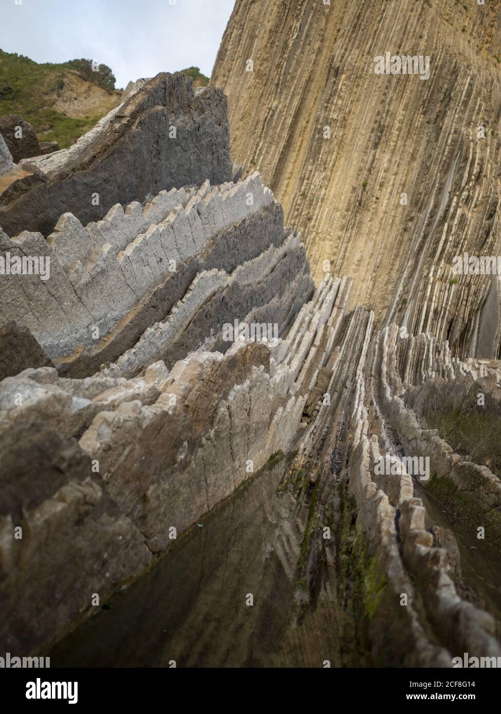 Vertical shot of rock formations and cliffs on a beach at daytime Stock ...
