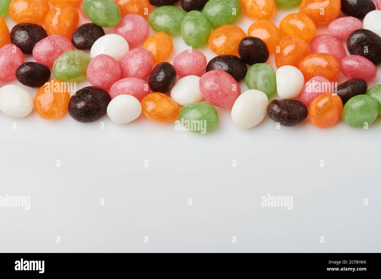 Colorful round candy with copy space on white studio background Stock ...