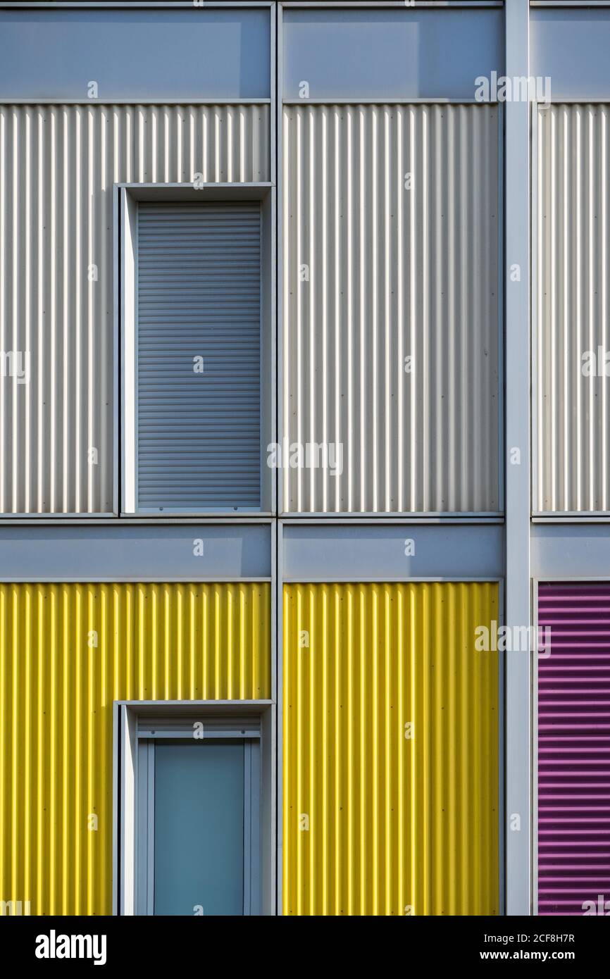 Exterior of contemporary colorful urban house with long half opened ...