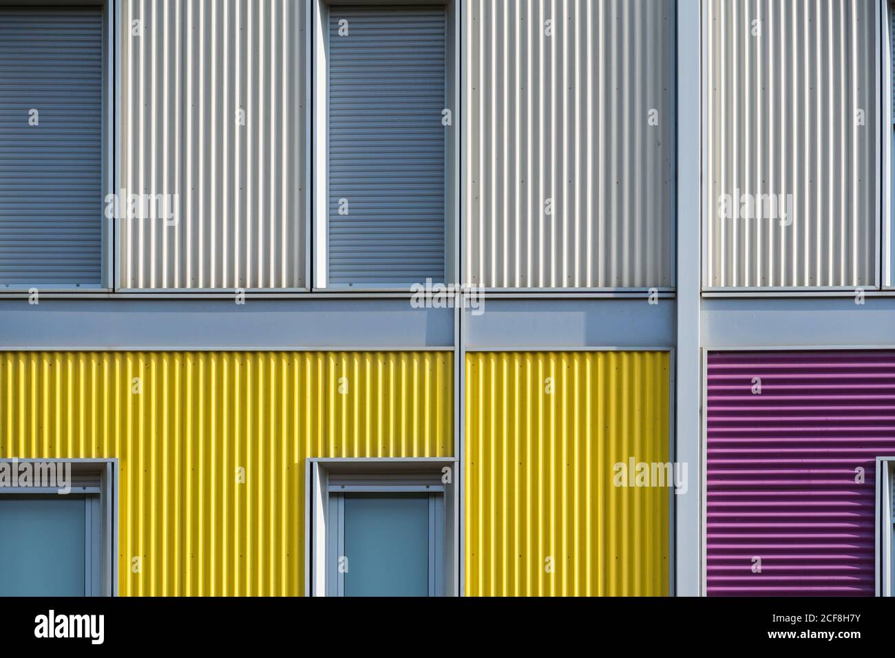 Exterior of contemporary colorful urban house with long half opened ...