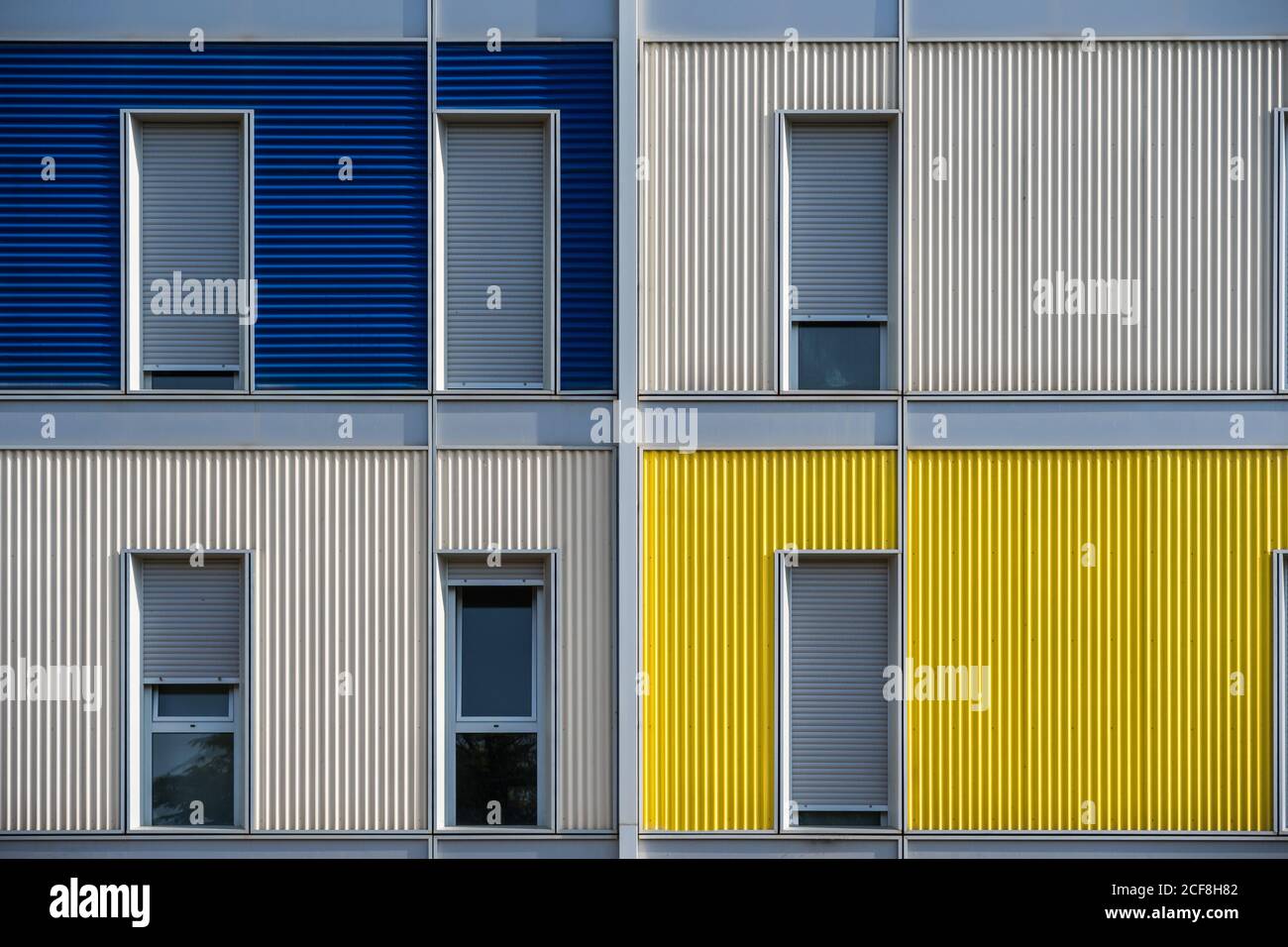 Exterior of contemporary colorful urban house with long half opened ...