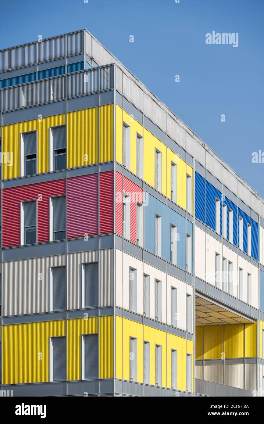 Exterior of contemporary colorful urban house with long half opened ...