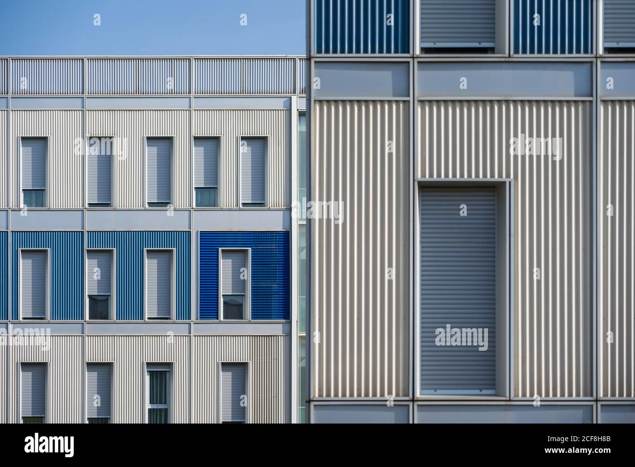 Exterior of contemporary colorful urban house with long half opened ...