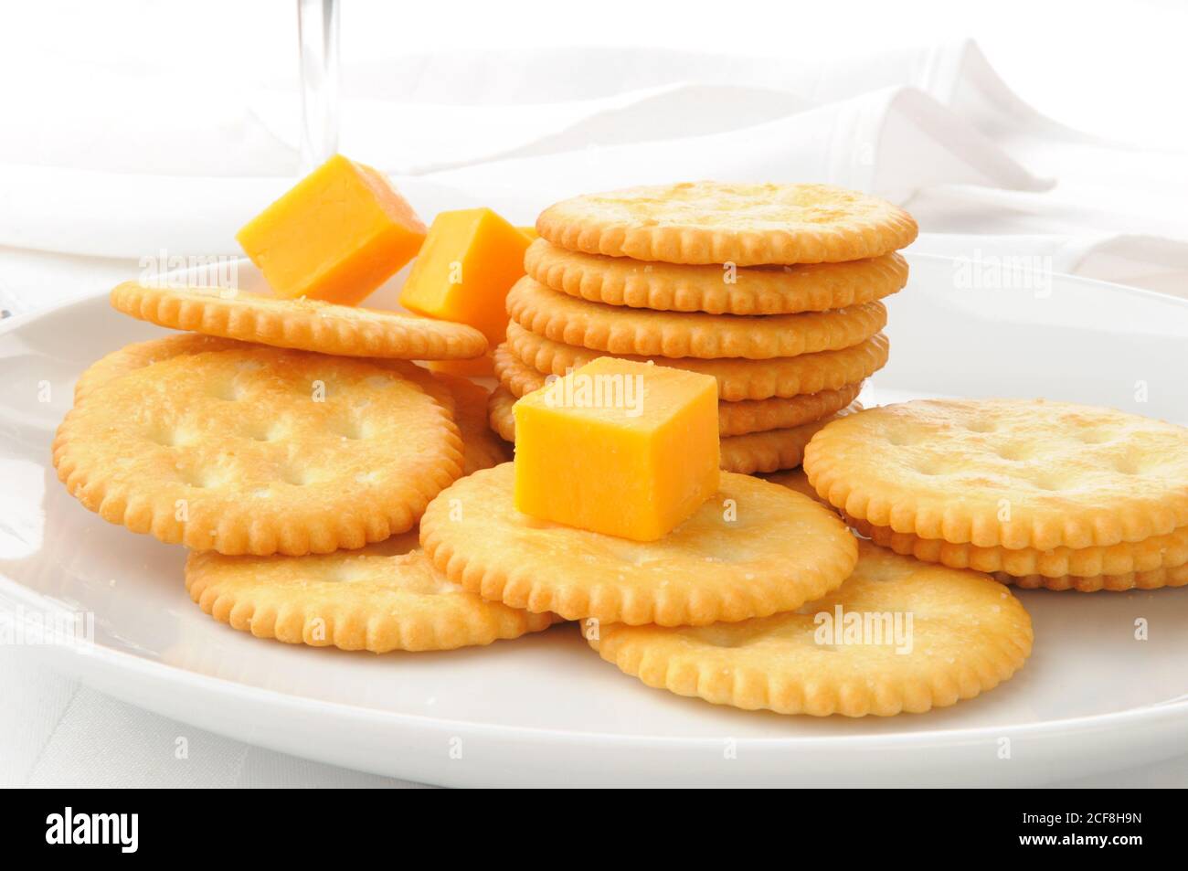 Cheddar cheese cubes and wheat crackers Stock Photo - Alamy