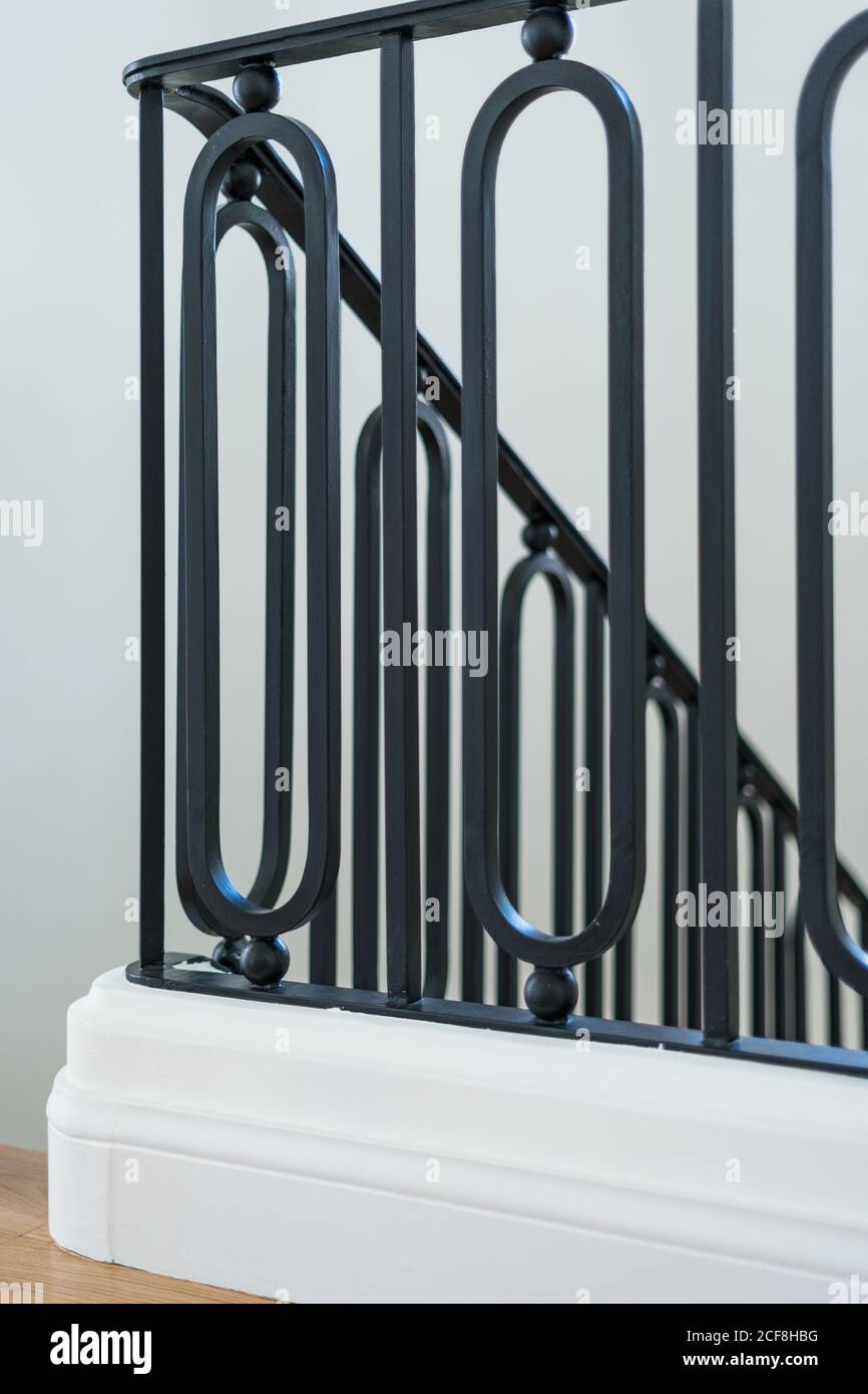 Forged decorative black railing in stylish light minimalist interior on ...