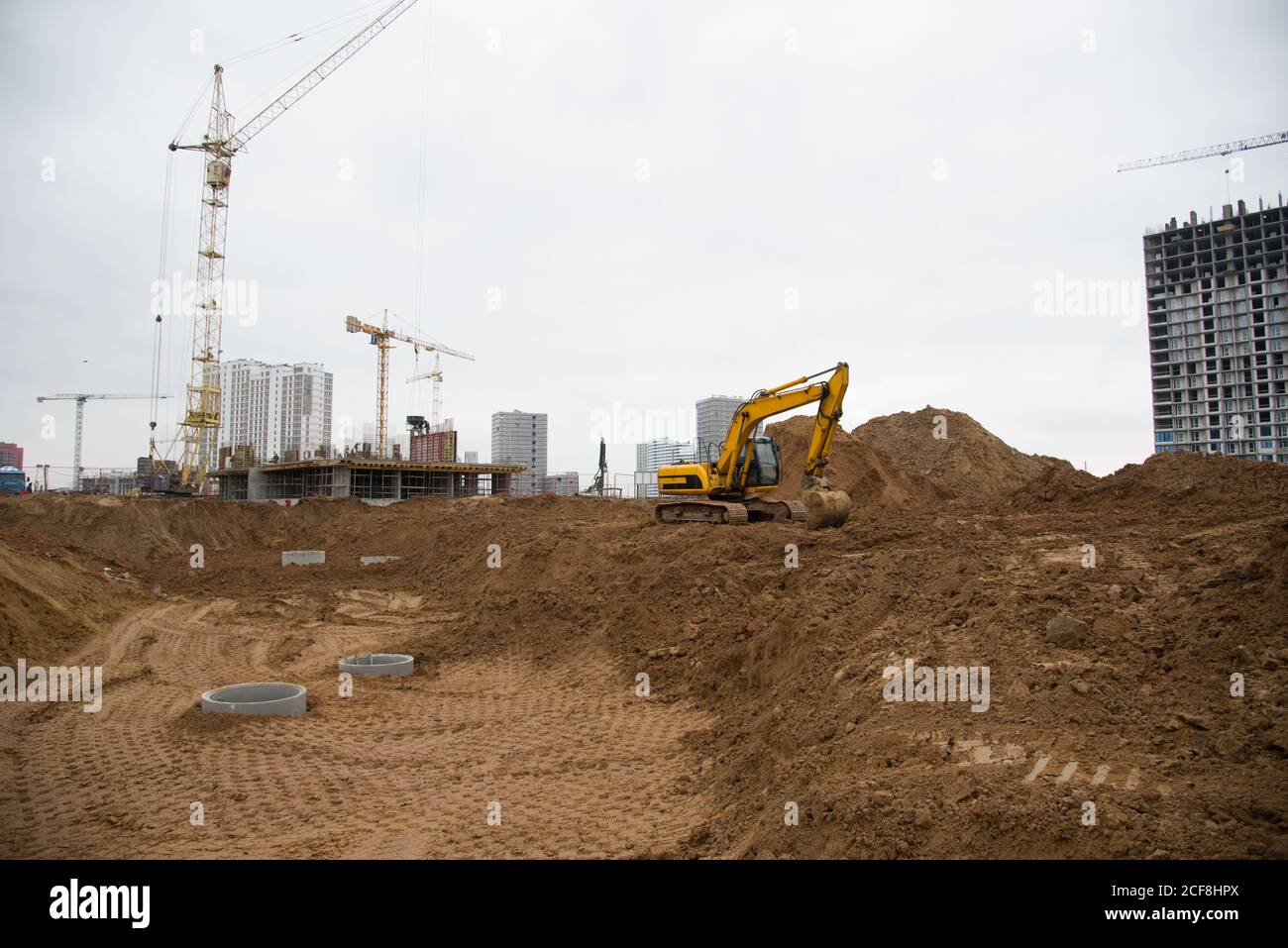 Track-type excavator during earthmoving at construction site. Backhoe ...