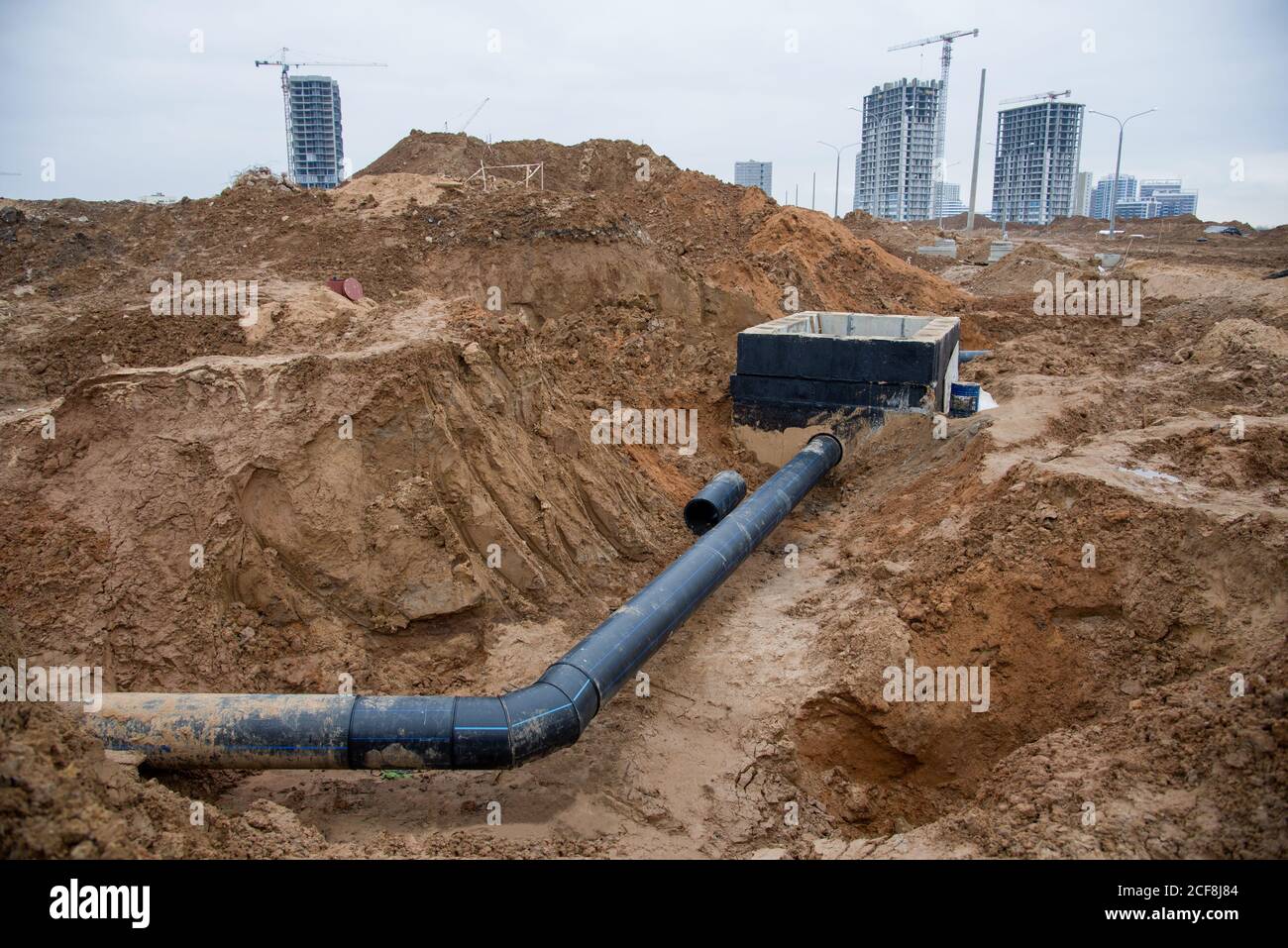Laying drain pipes and concrete manholes for stormwater system ...
