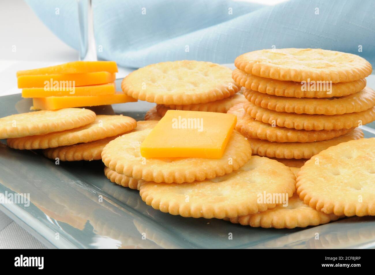 Closeup of a plate of crackers with cheddar cheese slices Stock Photo ...
