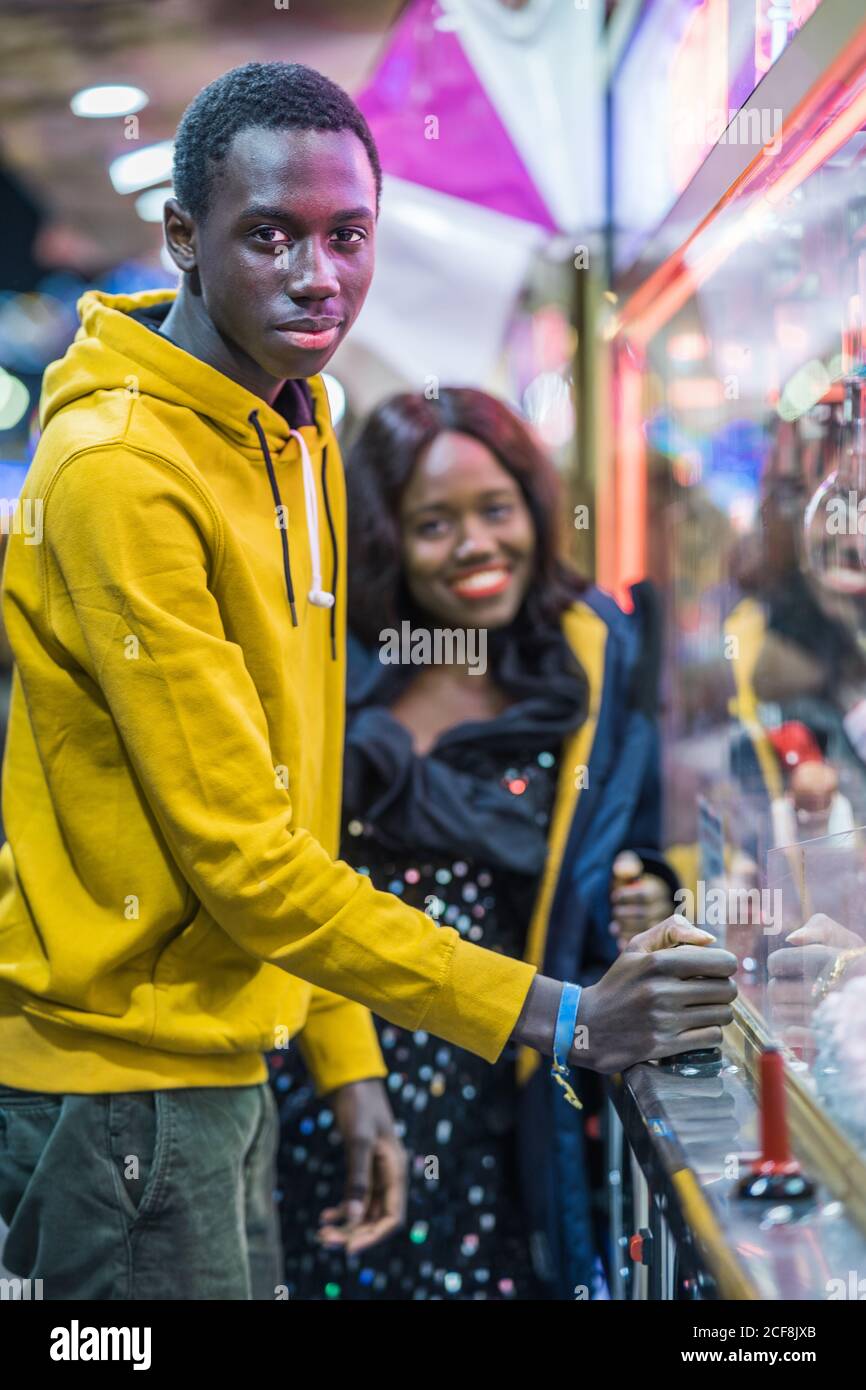 Cheerful young couple playing claw hi-res stock photography and images ...