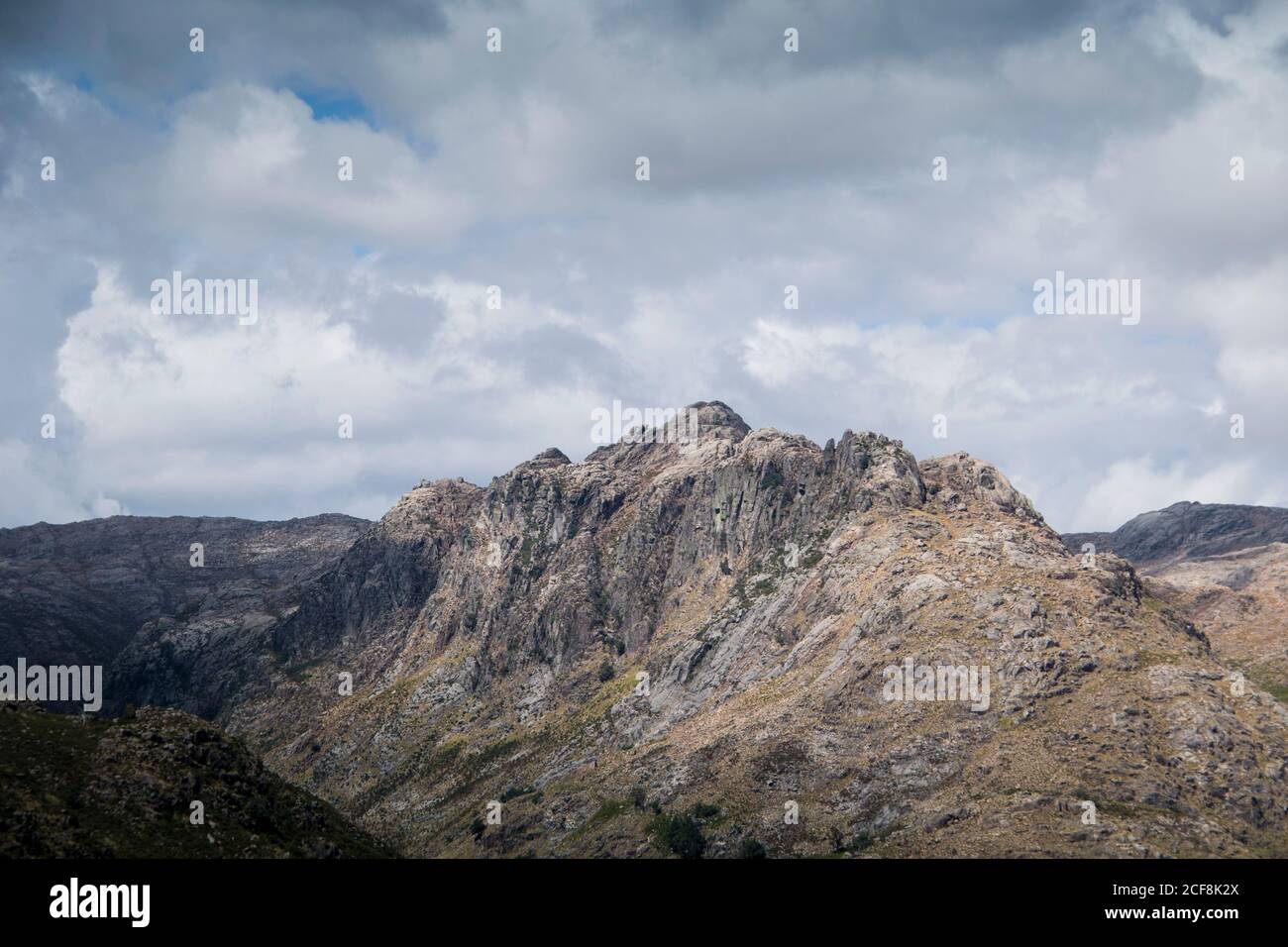 A rocky mountain landscape, with a high massif rock formation in a ...