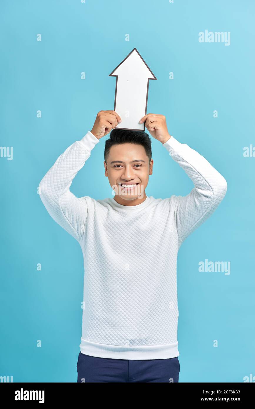 Man holding arrow sign hi-res stock photography and images - Alamy