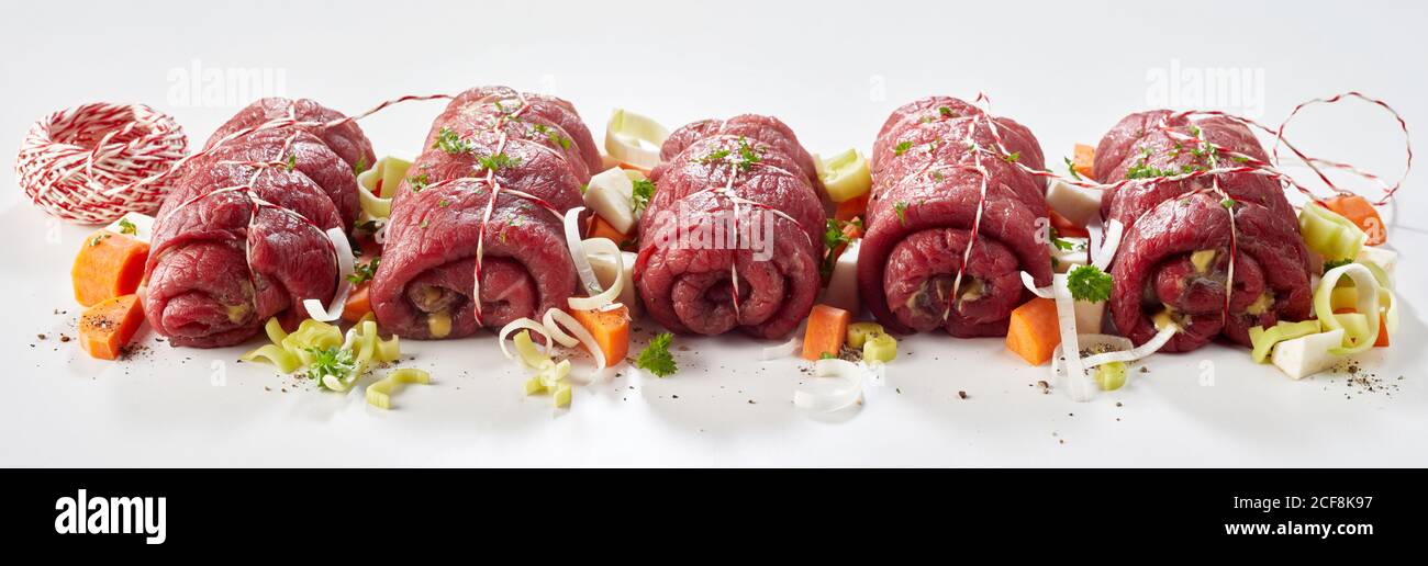 Ingredients for a beef roulade recipe with fresh diced vegetables and ...