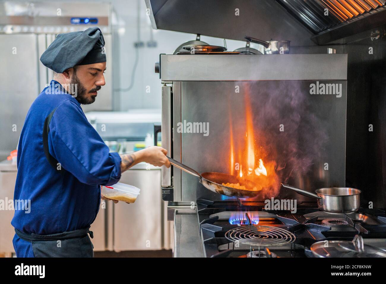 Chef cooking flame hi-res stock photography and images - Alamy