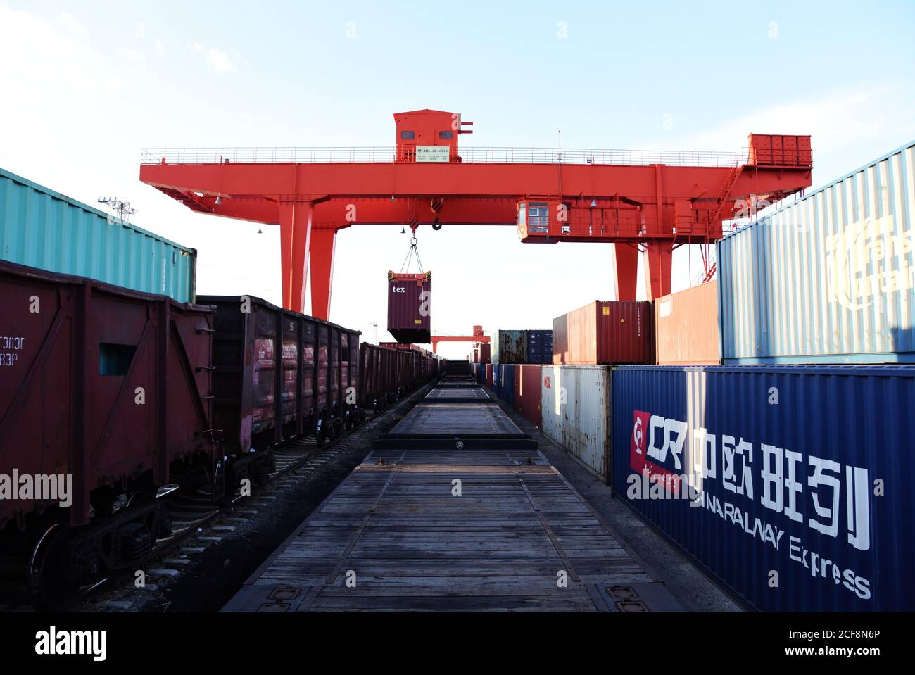 Hohhot. 4th Sep, 2020. A crane transports containers at Erenhot Port in ...