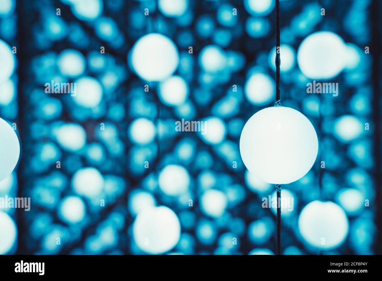 Background of glowing colorful blue lights with bright round bulb ...