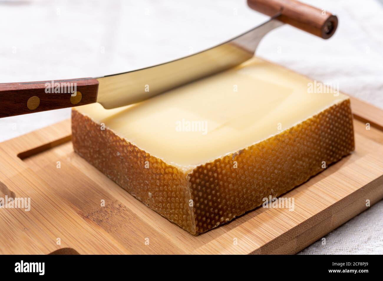 Block of Swiss medium-hard matured cheese gruyere used for baking ...