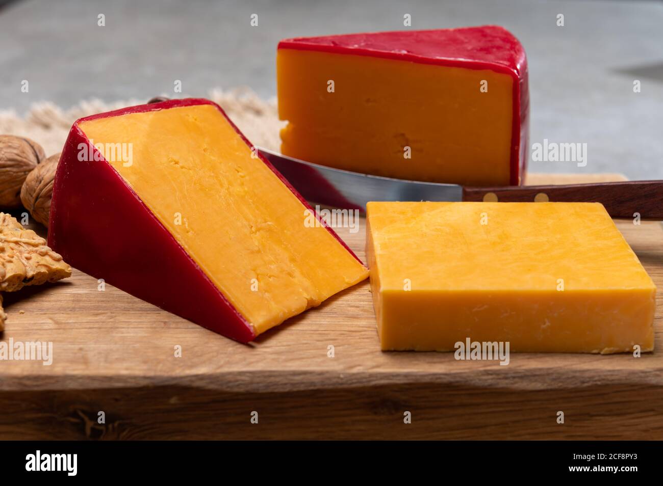 British red waxed yellow cheddar cheese close up Stock Photo - Alamy