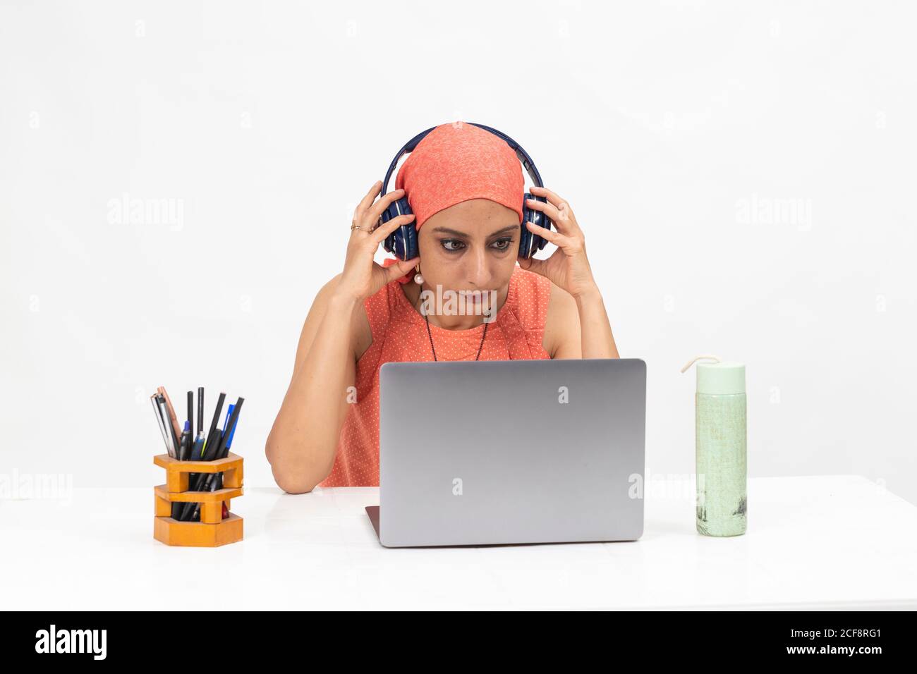 Pretty Indian woman at the table, distance learning for students ...