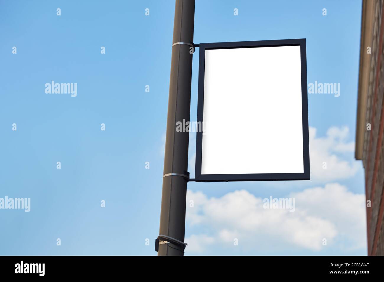 White blank mast sign as mast advertising mock-up template in front of ...