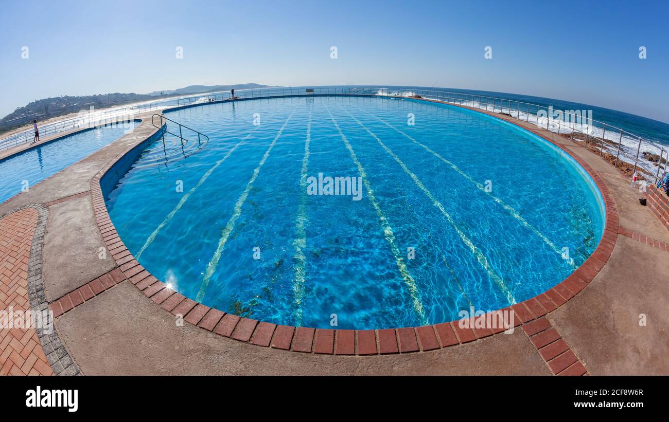 Beach public closeup panoramic photo of swimming pool right on rocky ...