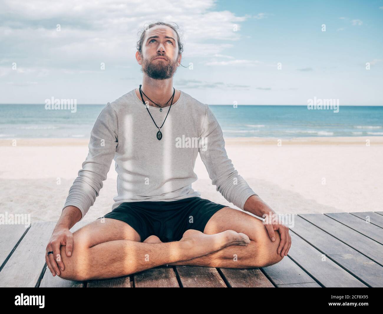 Male meditating hi-res stock photography and images - Alamy
