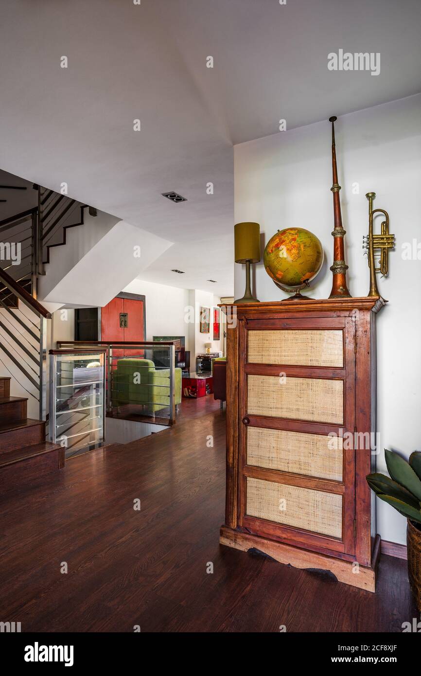 Fragment of interior of spacious house with retro wooden furniture ...