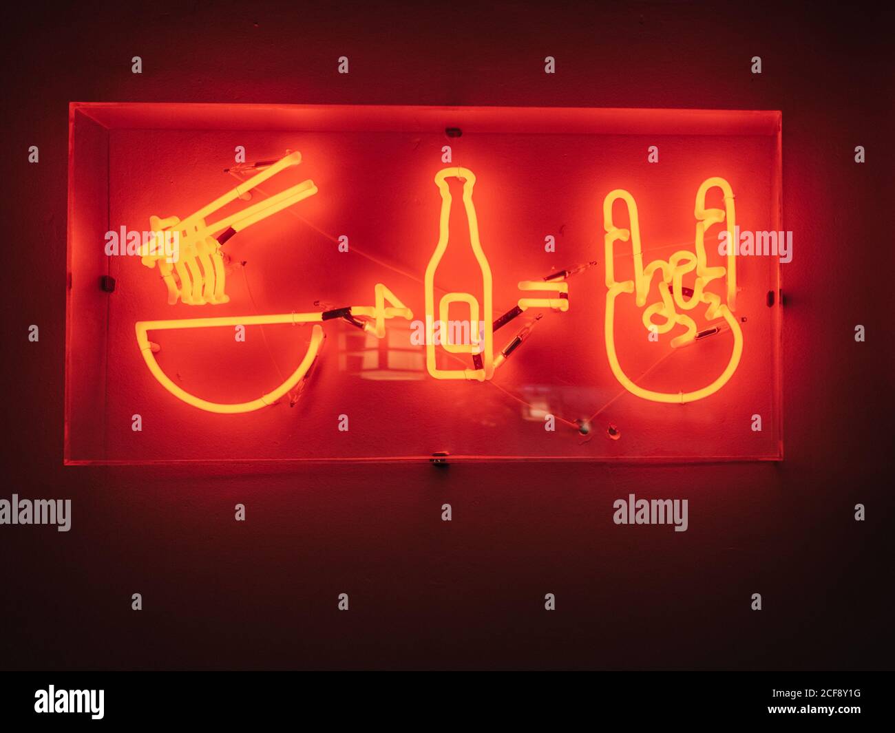 Illuminated signboard of Asian restaurant offering food and drinks ...