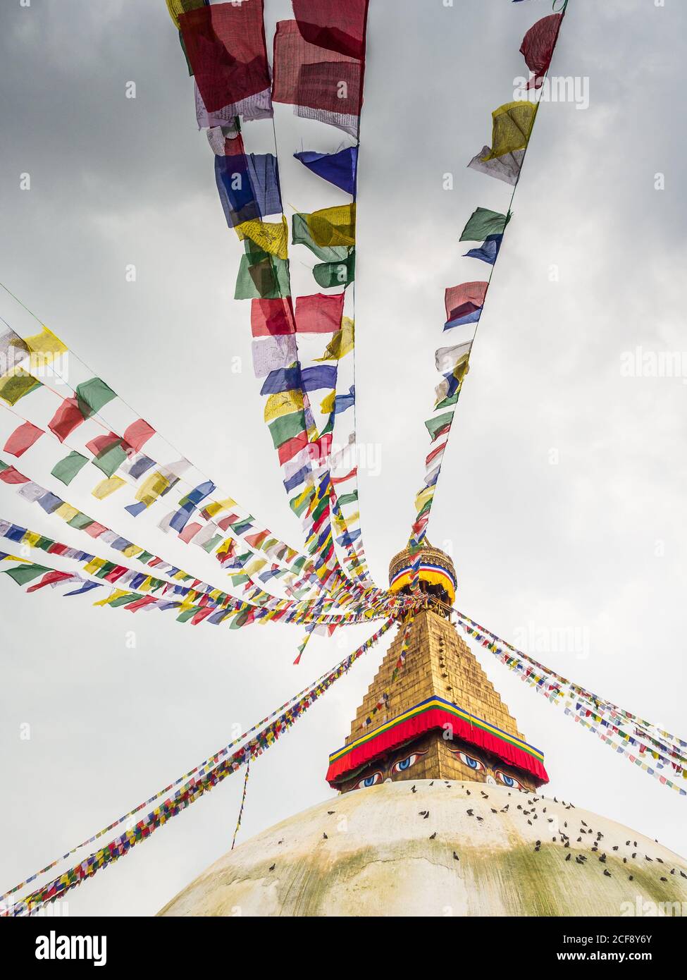NEPAL, BOUDHANATH STUPA - AUGUST 19, 2014: top of boudhanath stupa ...
