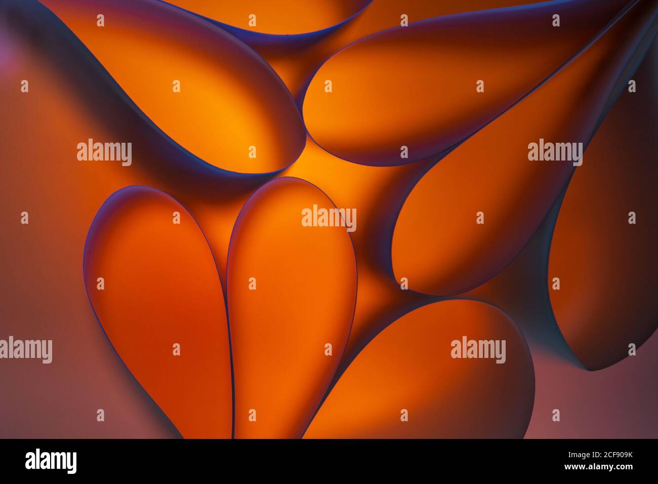 abstract orange background with glowing bubbles of different shapes and ...