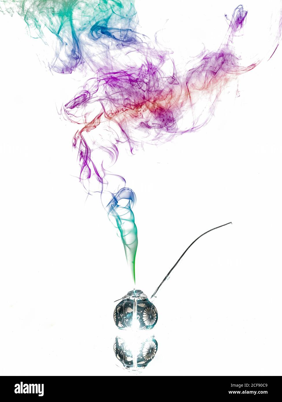 Jar with herbs emitting smoke Stock Photo - Alamy