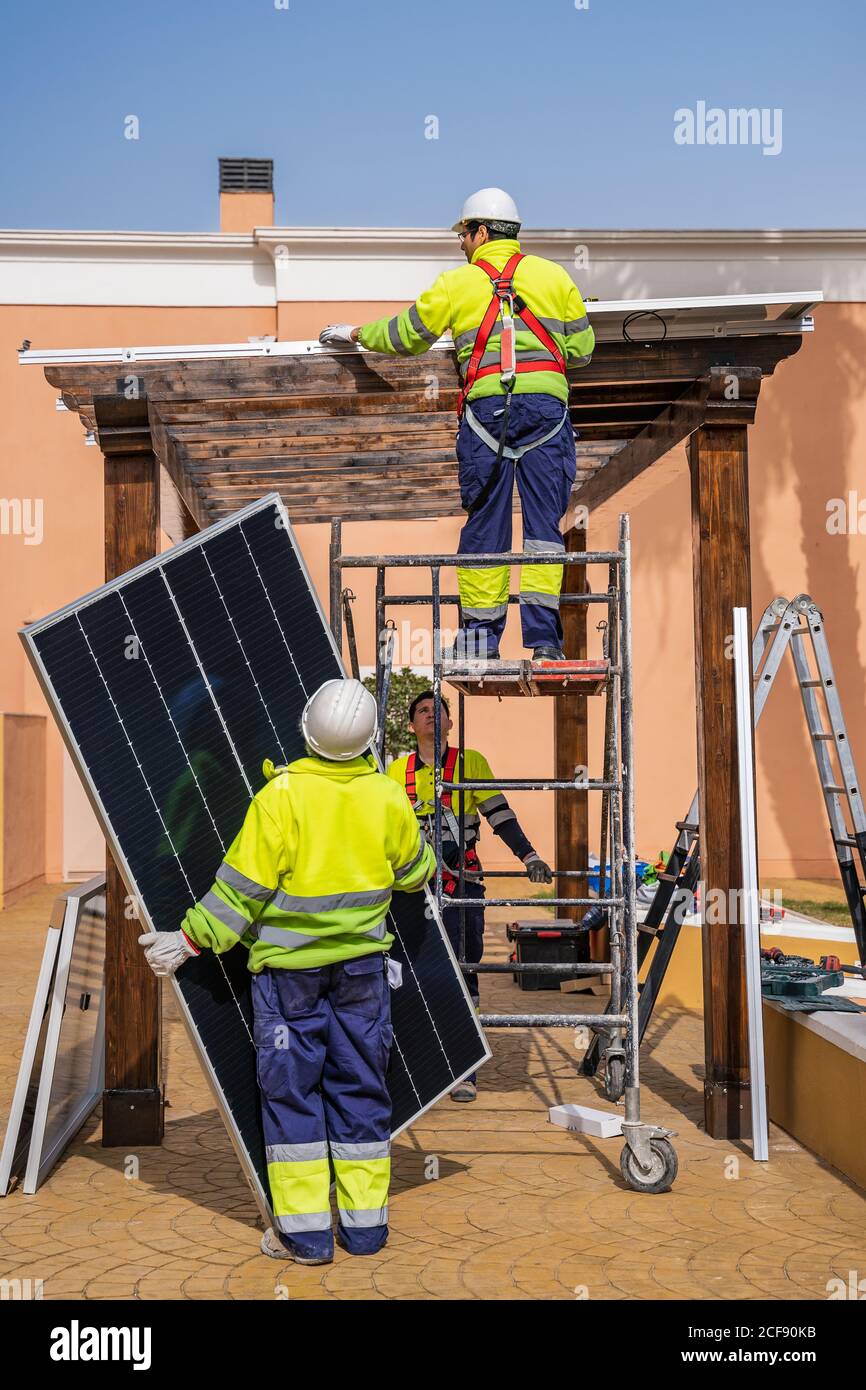 Installing solar panels on roof helmets hi-res stock photography and ...