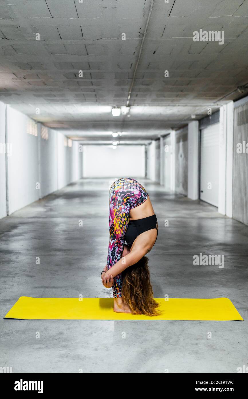 Standing forward bend pose hi-res stock photography and images - Alamy