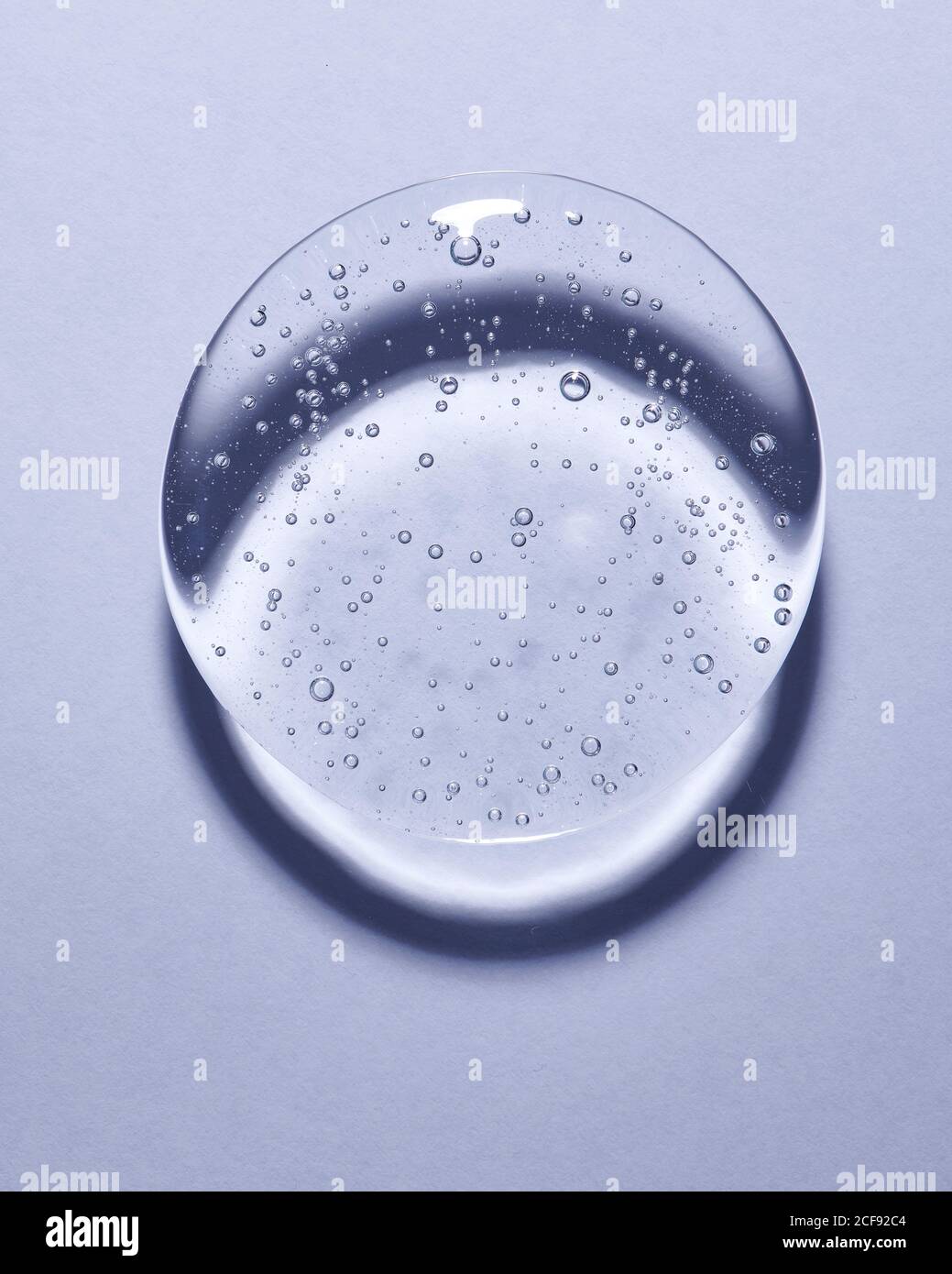 Single blob of transparent glycerin or gel. Glossy texture with tiny ...