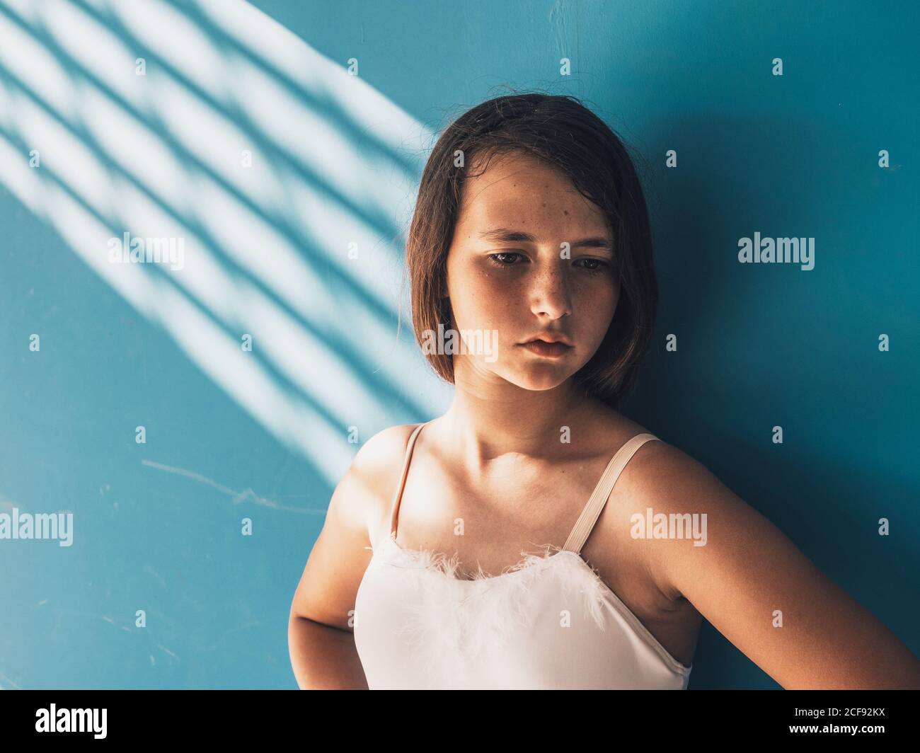 Ballerina standing with sad face near wall Stock Photo - Alamy
