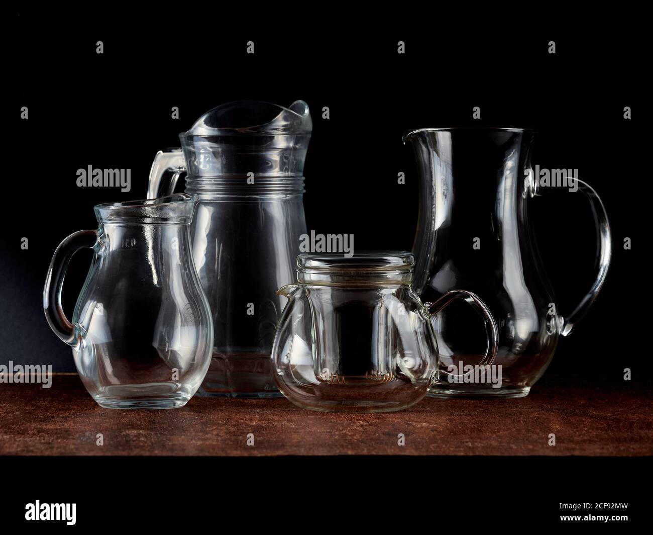 Group of transparent glass jars to contain liquids Stock Photo - Alamy