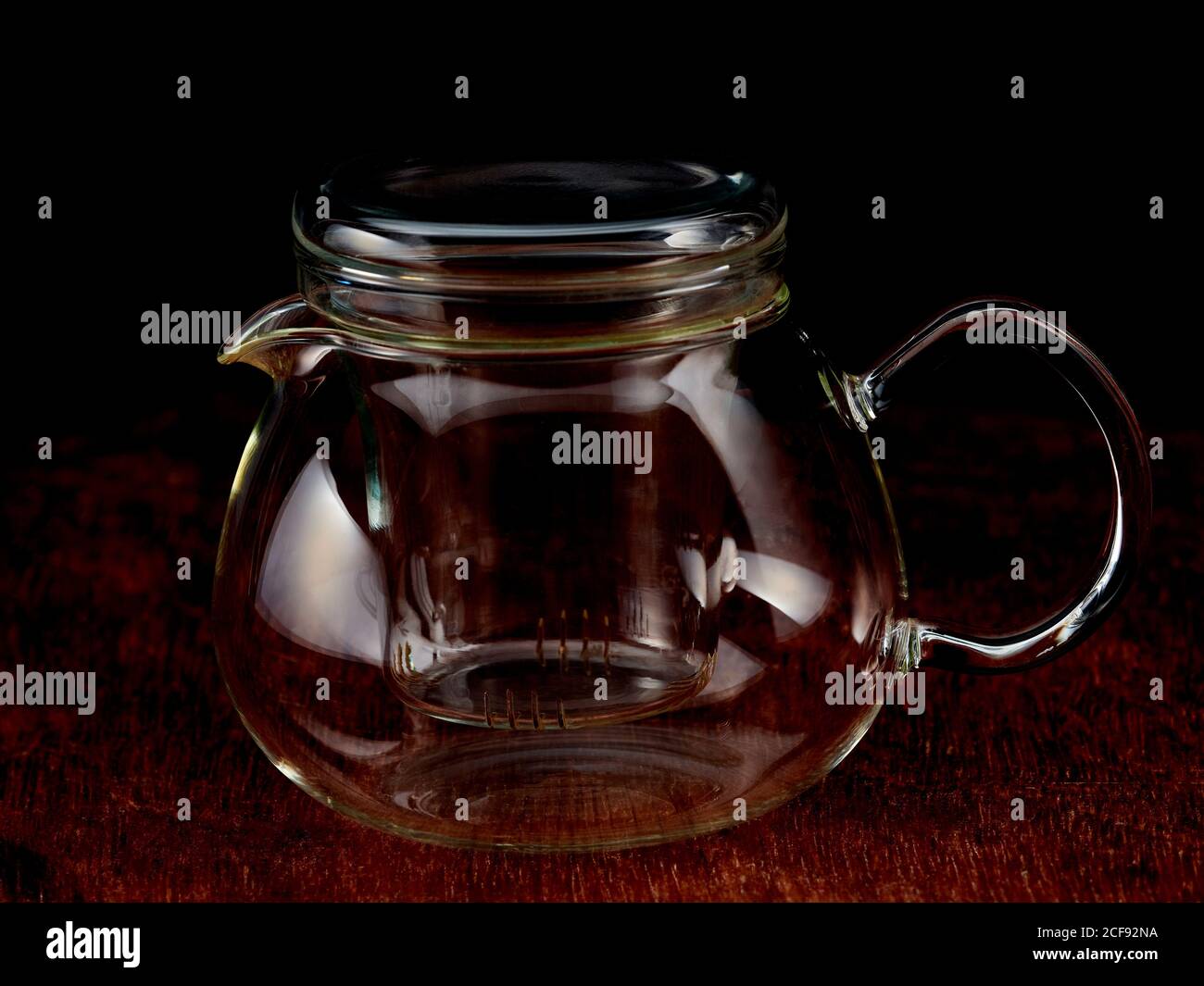 The contours of an empty glass teapot Stock Photo - Alamy