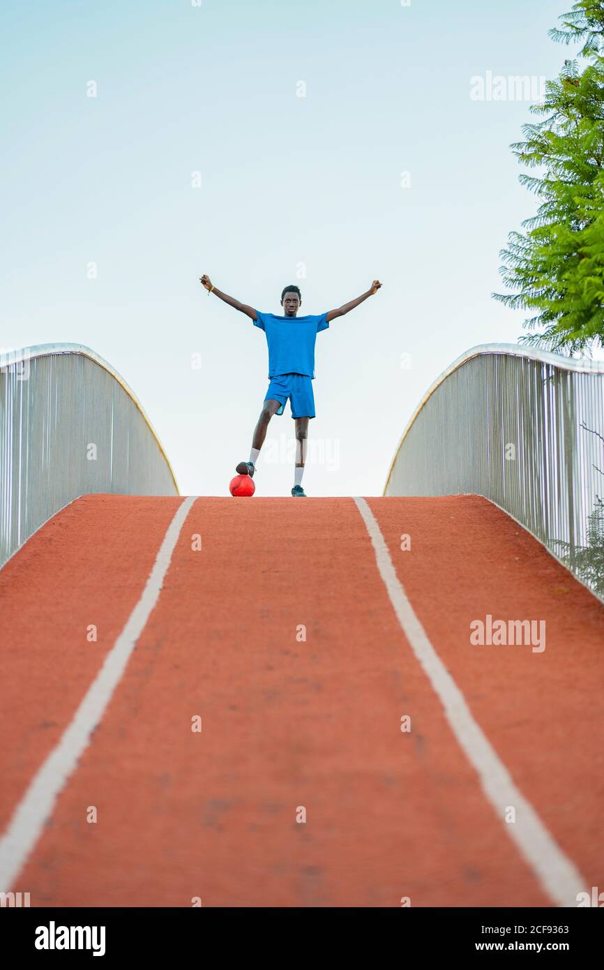 Ethnic football player celebrating success Stock Photo - Alamy