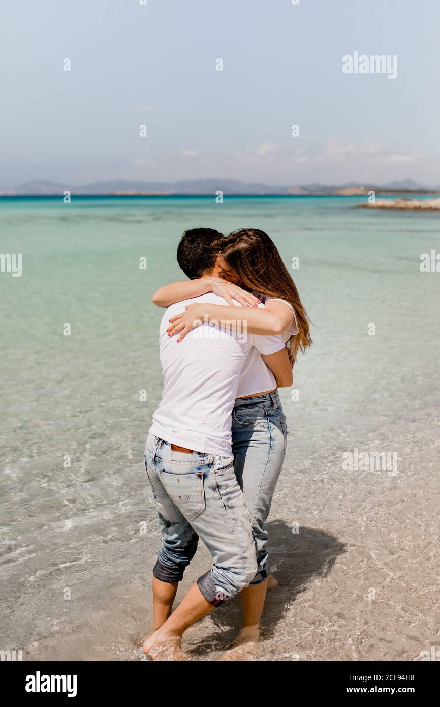 Amorous couple bonding in sea water Stock Photo - Alamy
