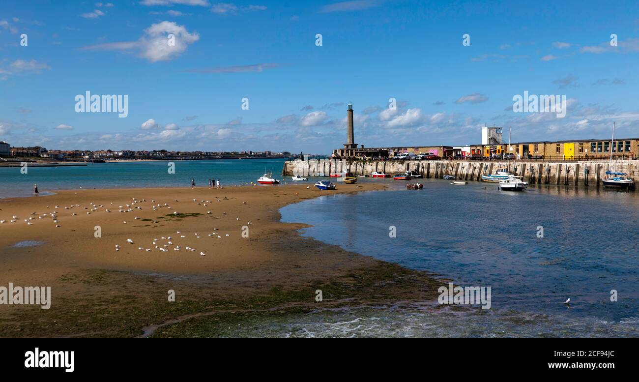 Panoramic view of Margate Harbour Arm with the tide coming in Stock ...
