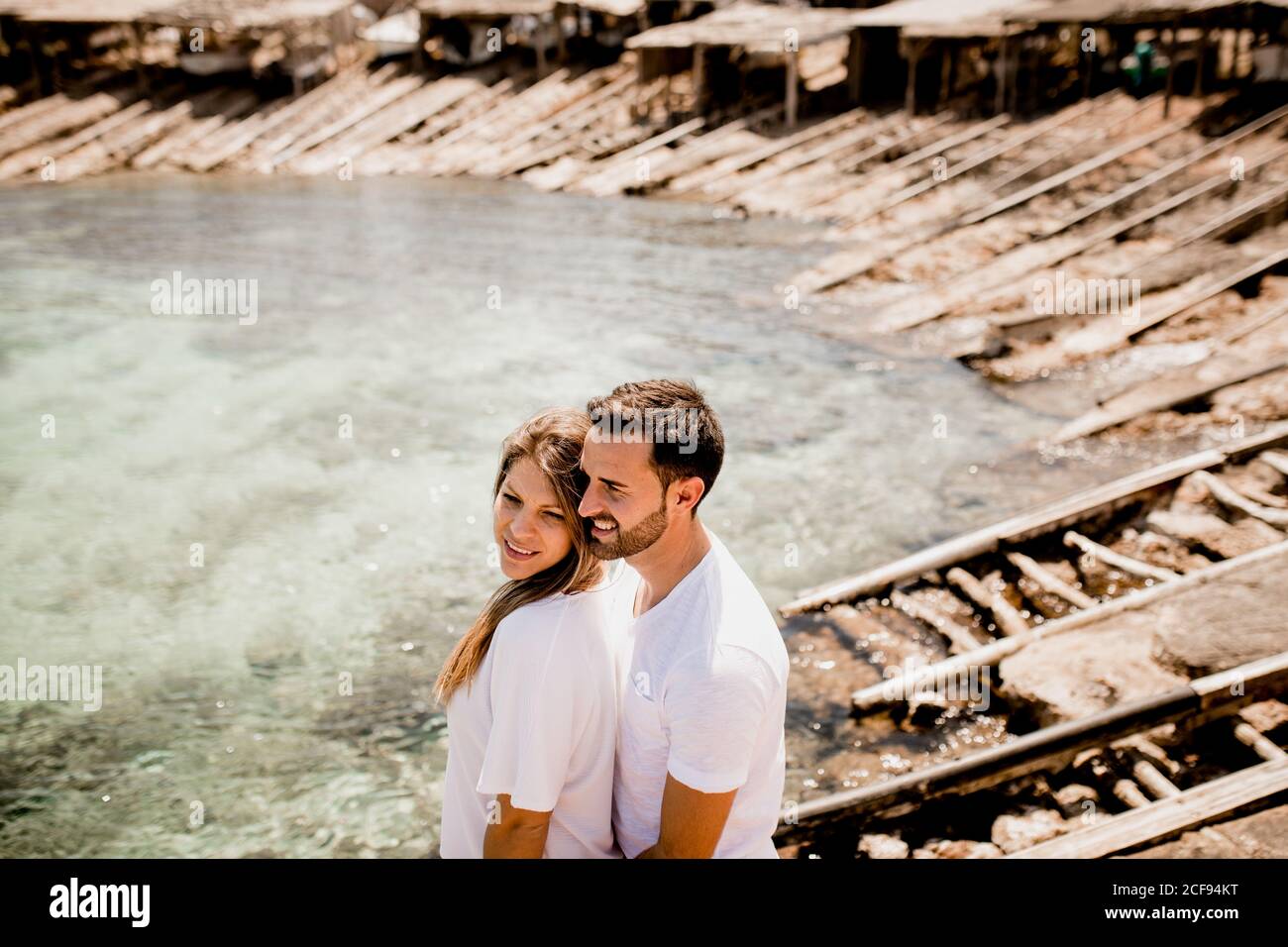 Happy lovers cuddling at cove Stock Photo - Alamy