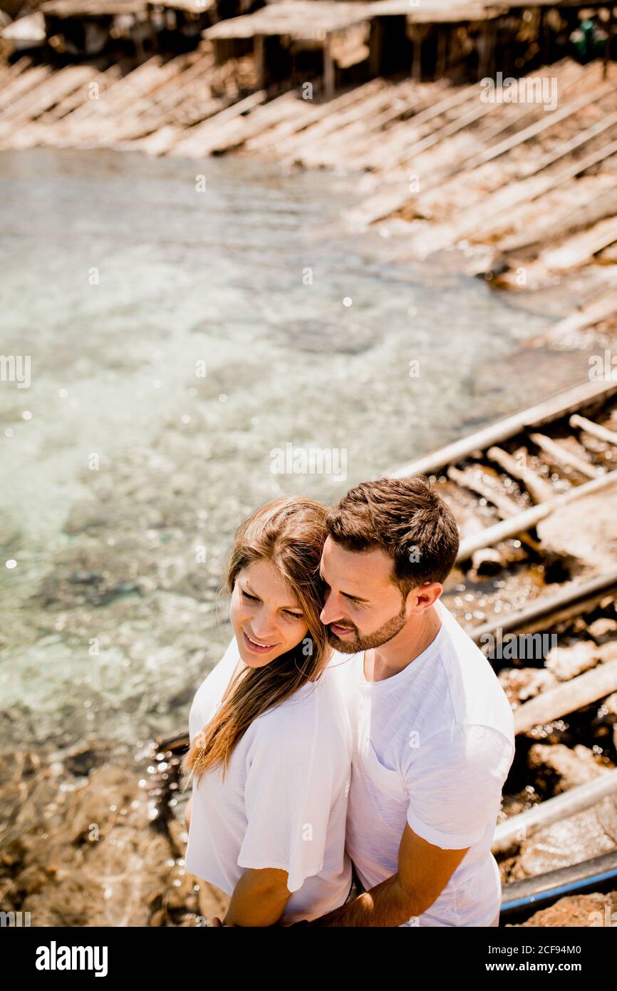 Happy lovers cuddling at cove Stock Photo - Alamy