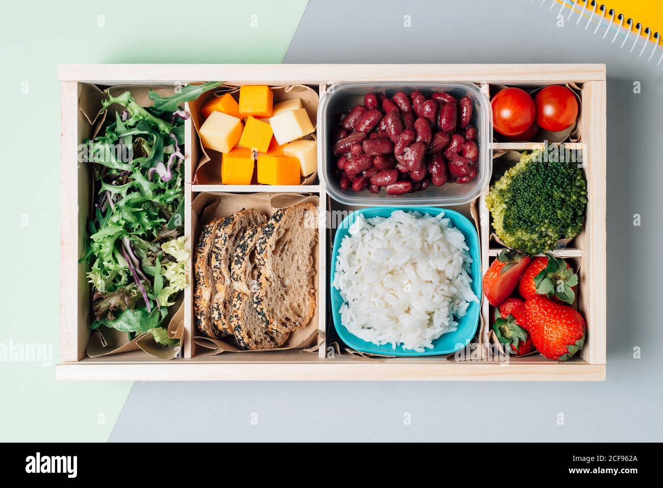 food box with diet ingredients by copybook and plate Stock Photo - Alamy