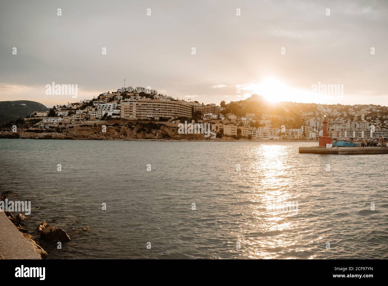 Aerial view of sea port with tightly stayed buildings with red roofs ...