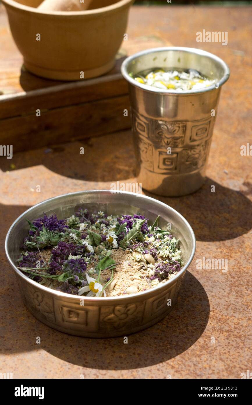 scrub of natural ingredients in indian bowl, vessel with water ...