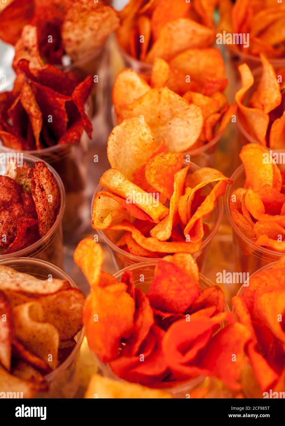 From above food background with various tasty savory crispy chips ...